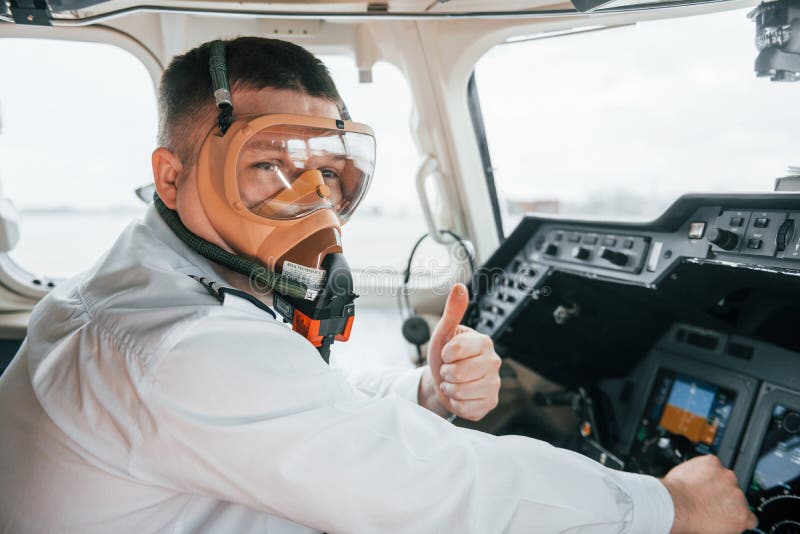 In Oxygen Mask. Pilot on the Work in the Passenger Airplane Stock Photo ...