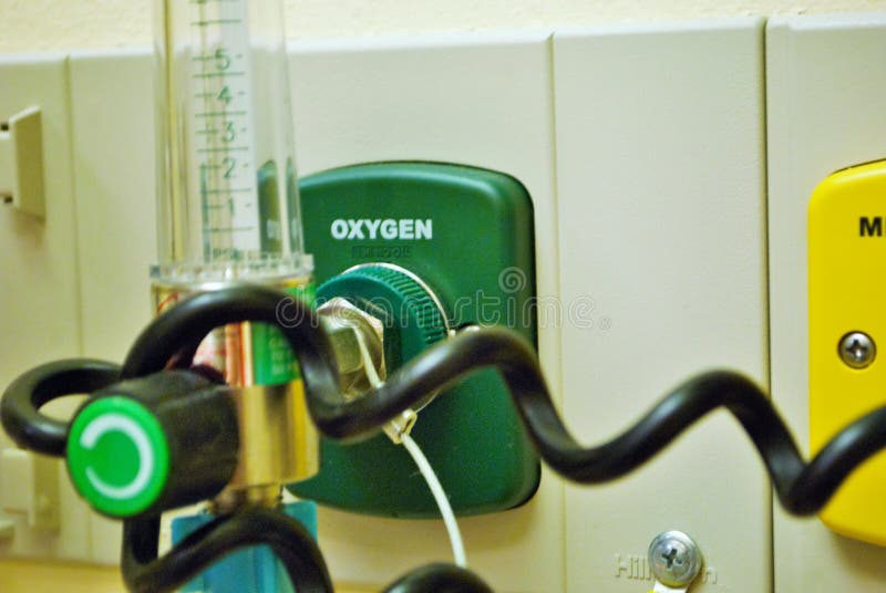 Oxygen Flow Meter Plugged In The Green Outlet On Hospital Wall, Medical ...