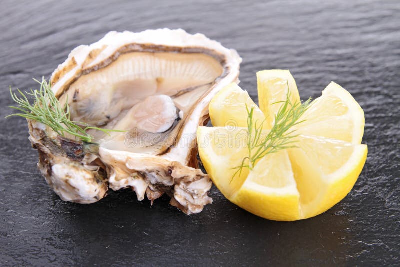 Oyster and lemon stock photo. Image of luxury, dinner - 27642852