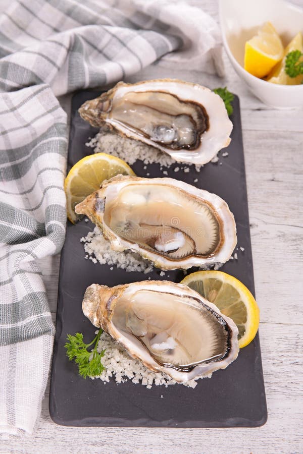 Oyster with lemon stock photo. Image of festive, menu - 162286010