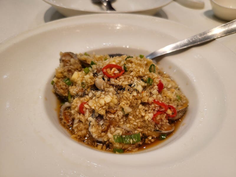 Oysters Cooked with Garlic and Chilli Stock Photo - Image of garlic ...