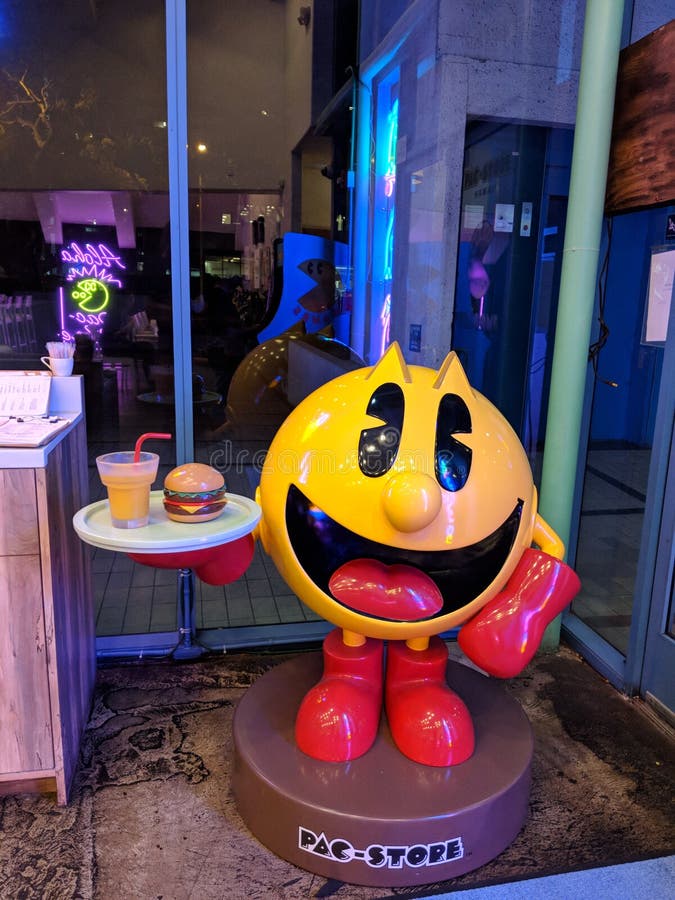 Pac-Man Figure Serving Burger and Drink on Display at Pop-up Pac-Store ...
