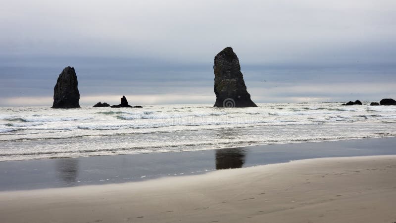 Pacific Ocean at Haystack Rock Oregon Coast Stock Image - Image of sand ...