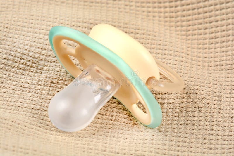 Pacifier on a Beige Background Stock Image - Image of flat, infant ...