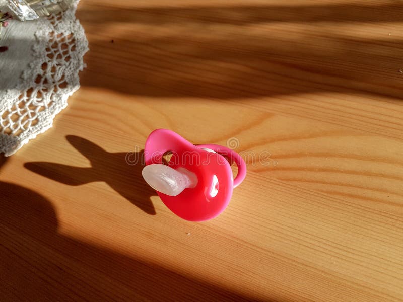 Pacifier Red on Wooden Table Stock Photo - Image of dummy, newborn ...