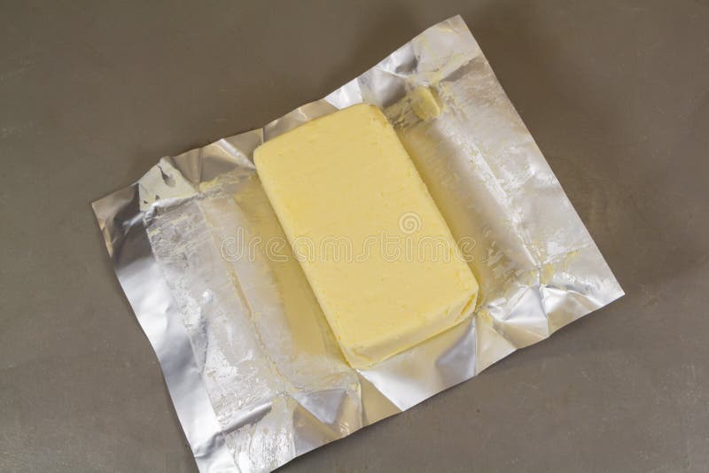 Pack of Butter in a Butter Dish Stock Photo - Image of package, yellow ...