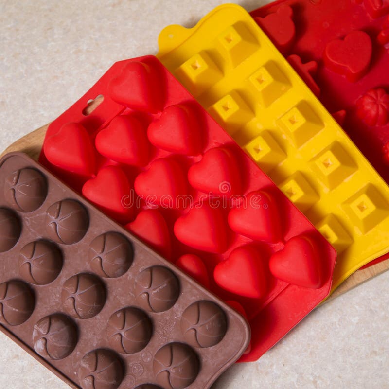 Pack of Chocolate Forms for Homemade Candies on a Neutral Background ...