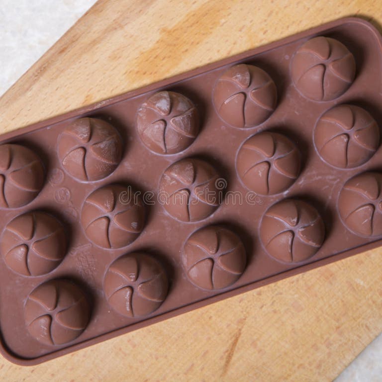 Pack of Chocolate Forms for Homemade Candies on a Neutral Background ...