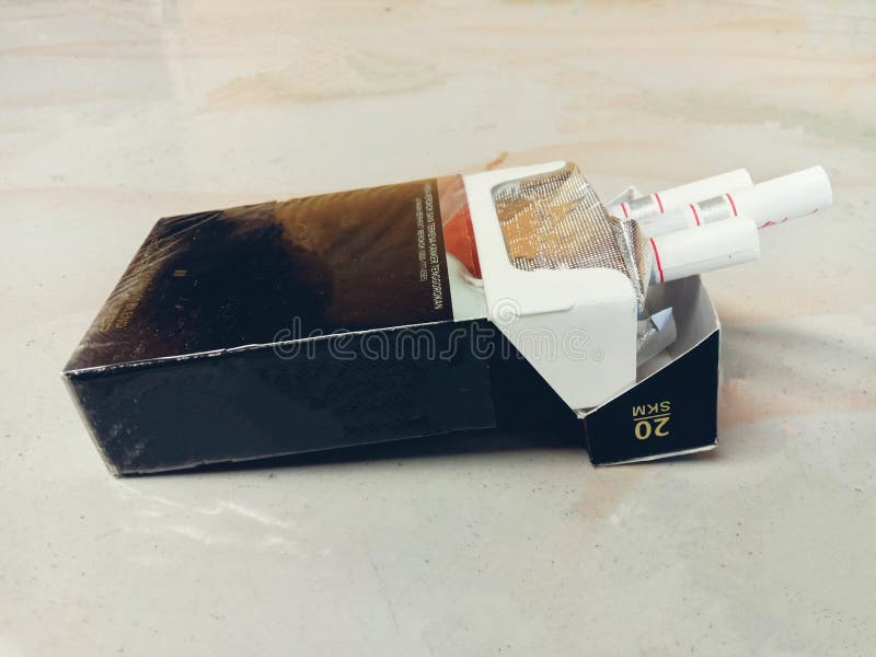 A Pack of Cigarettes Lay on the Floor Where he Usually Relaxed Stock ...