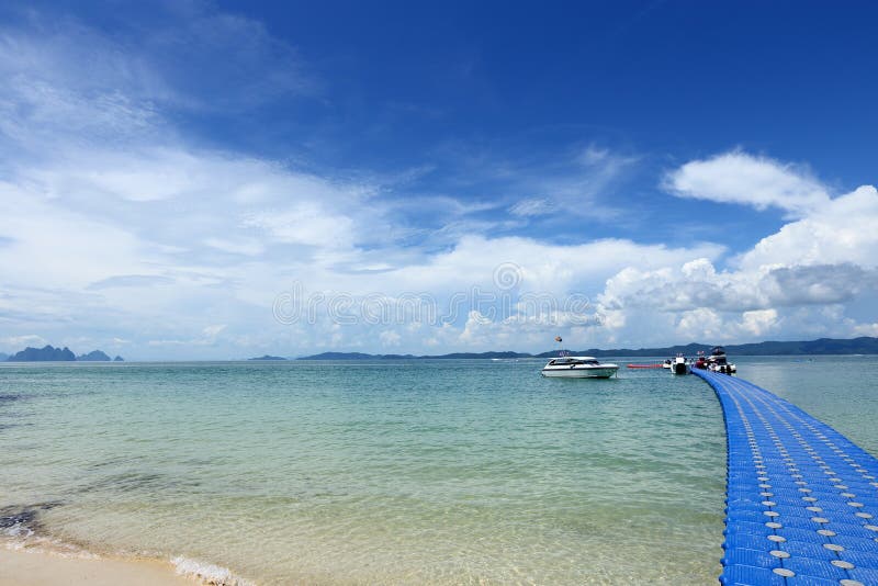 Pack Group of Blue Cubes Float on Clear Ocean Beautiful Beach for ...