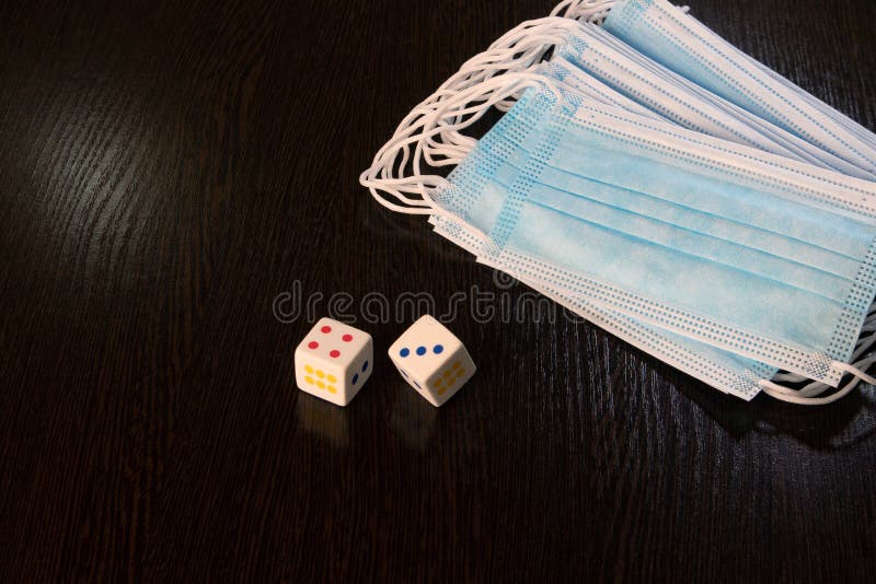 Pack of Medical Protective Face Masks and Two Dices Stock Photo - Image ...