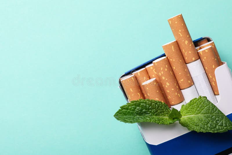 Pack of Menthol Cigarettes and Mint on Turquoise Background, Top View ...