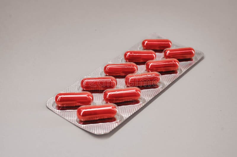 Pack of Red Capsules-tablets in the Amount of Ten Pieces. the View from ...