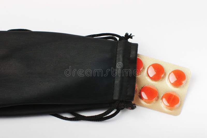 Pack of Red Pills Sticking Out of Black Bag Stock Image - Image of ...