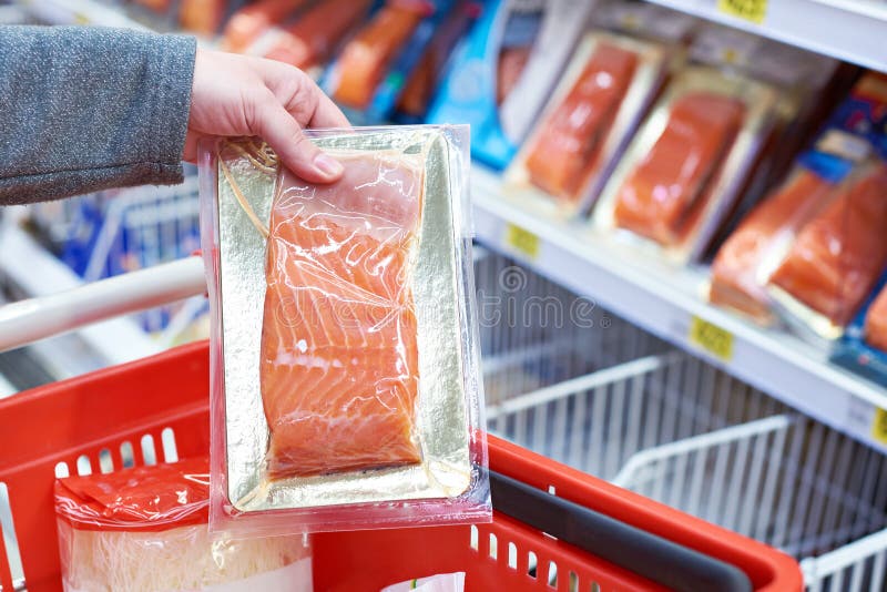 Pack of Salmon in Hand at Store Stock Photo - Image of closeup, buyer ...