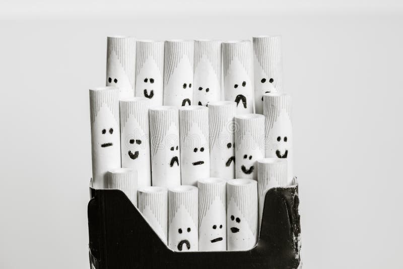 Pack of White Cigarettes with Faces Painted Stock Image - Image of ...