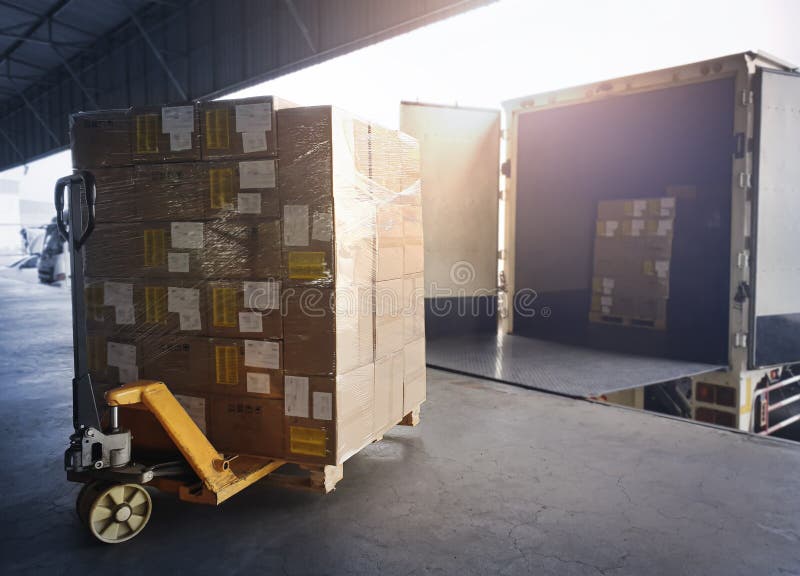 Package Boxes Loading into Container Truck. Truck Parked Loading at ...