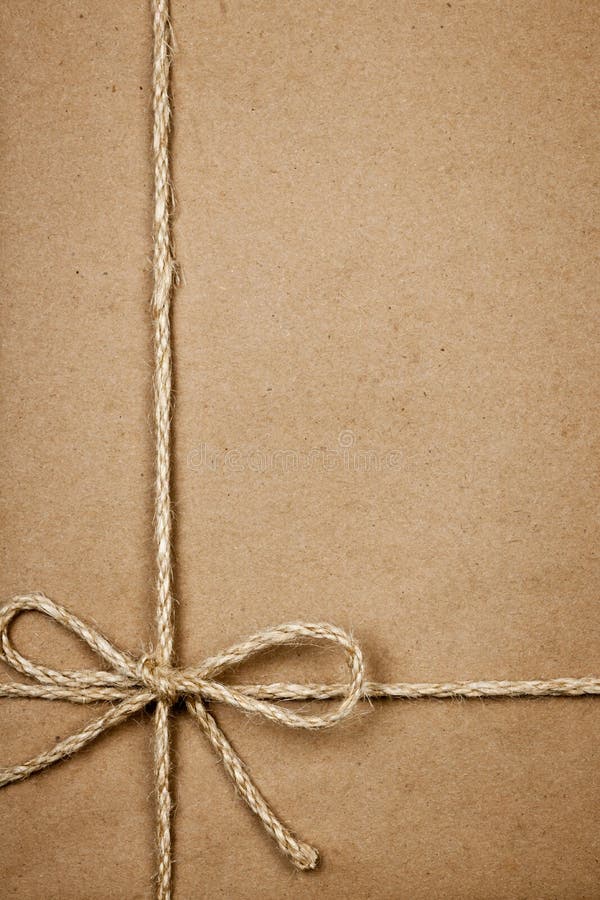 String Bow on Brown Paper stock photo. Image of recycled - 22999590