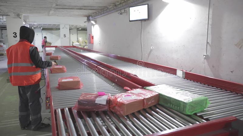 Conveyor scanning parcels stock video. Video of logistics - 269216291