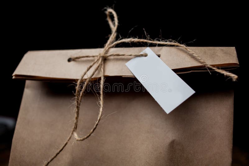 Package of Kraft Paper with Tag for Recording on a Soft White Blanket ...