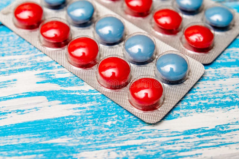 A Package of Red and Blue Tablets Stock Photo - Image of tablet, blue ...