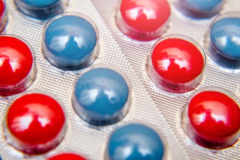 A Package of Red and Blue Tablets Stock Photo - Image of tablet, blue ...
