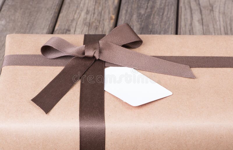 Package with Ribbon and Bow Stock Photo - Image of brown, surprise ...