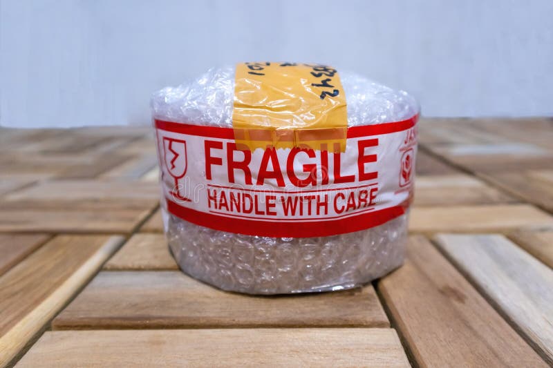 A Package Wrapped with Air Bubble Plastic and Fragile Packing Tape ...