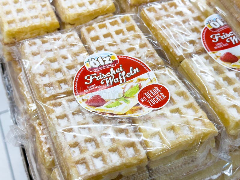 Packaged Fresh Waffles with Powdered Sugar and Strawberry Decoration ...