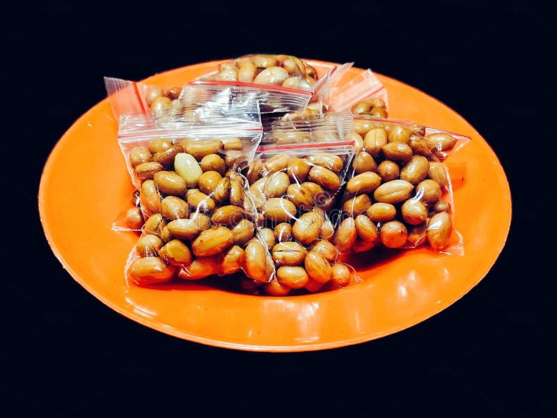 Packaged Fried Peanuts Served on an Orange Plate Stock Photo - Image of ...