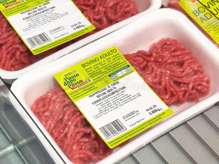 Packaged Ground Beef Display with Multilingual Labeling in Supermarket ...
