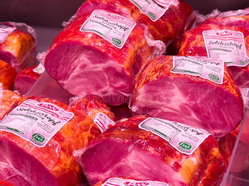 Packaged Ham Cuts with Labels Displayed in a Grocery Store Meat Section ...