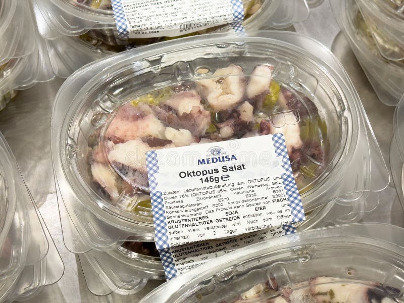 Packaged Octopus Salad in Clear Containers with Labels Displaying ...