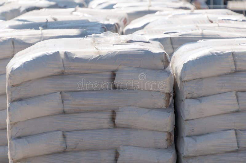 Packages with Bags of Cement. Construction Site Stock Photo - Image of ...