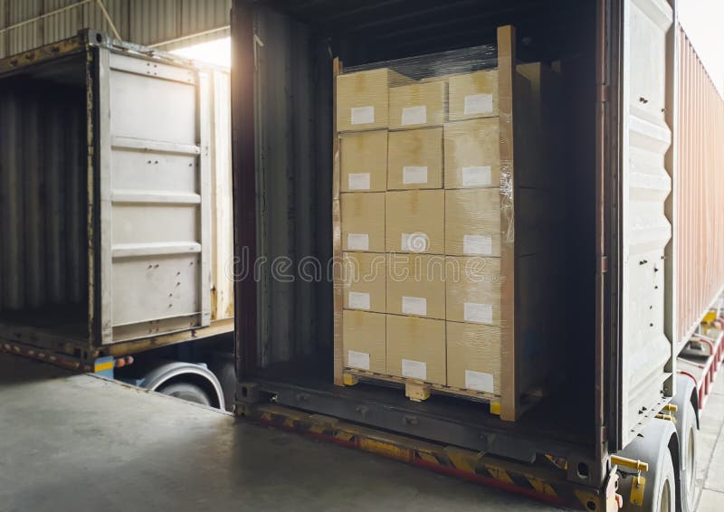 Packaging Boxes on Pallets Loading into Shipping Cargo Container at ...