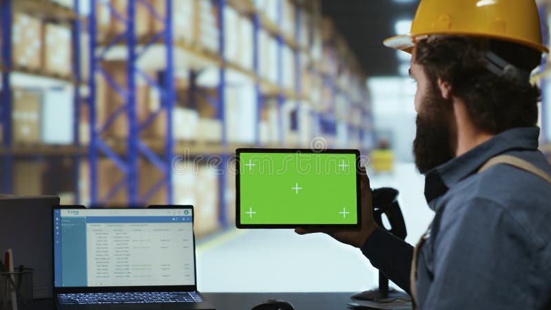 Packaging Manager Holding Tablet with Greenscreen in Facility Stock ...