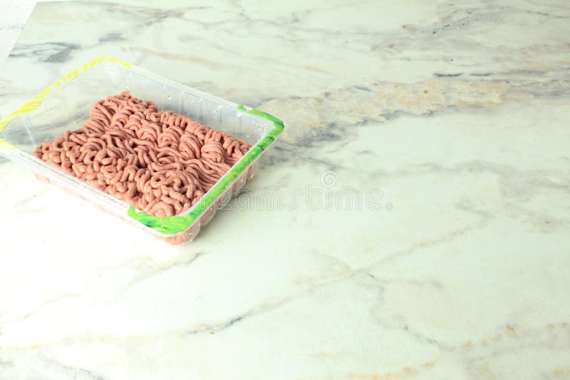 Packaging of Minced Chicken Pork on the Table. Raw Semi-finished ...