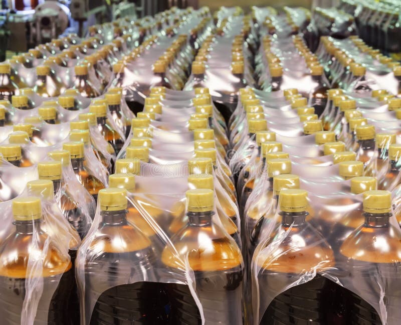 Packaging Plastic Bottles at the Brewery. Stock Photo - Image of ...