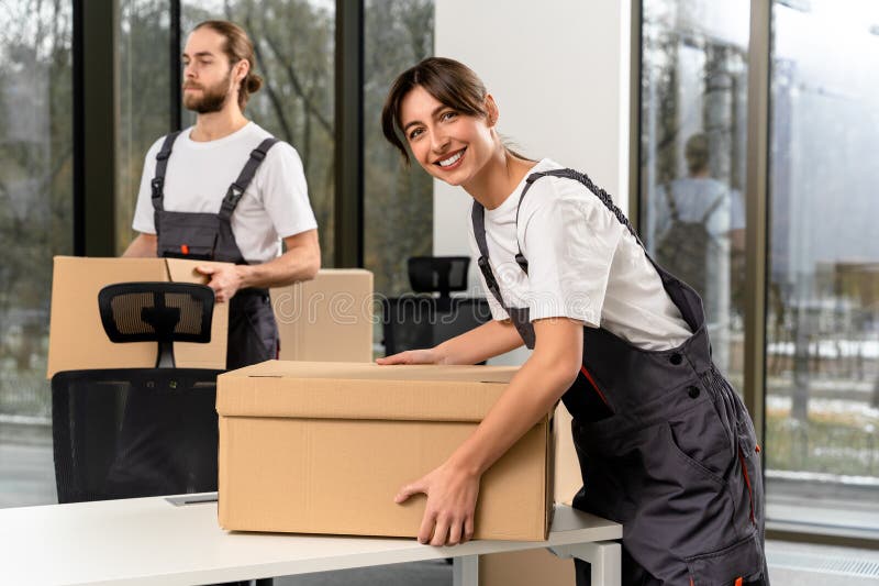 Team of Young Colleagues Working in a Packaging Office Stock Photo ...