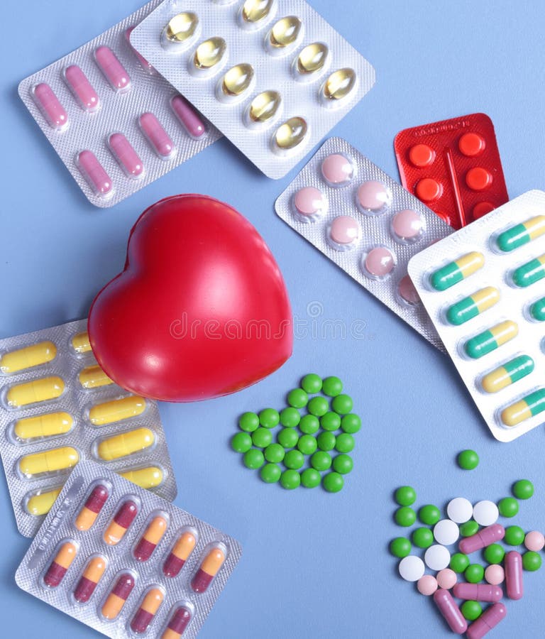 Packaging of Tablets and Pills on the Table. Red Heart Stock Photo ...