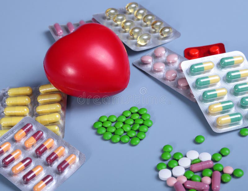 Packaging of Tablets and Pills on the Table. Red Heart Stock Image ...