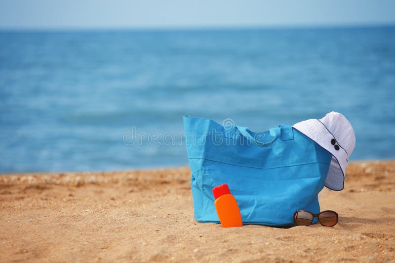 Packed Beach Bag on Empty Sand Beach Stock Photo - Image of travel ...