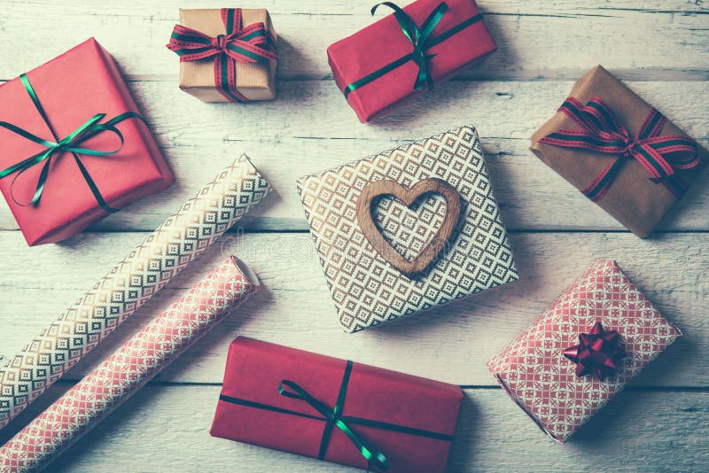 Packed Gifts and Wrapping Paper on White Wood Table Stock Photo - Image ...