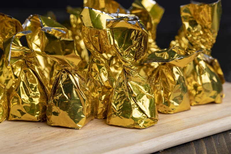 Packed in Golden Foil Truffle Candy on the Board Stock Photo - Image of ...