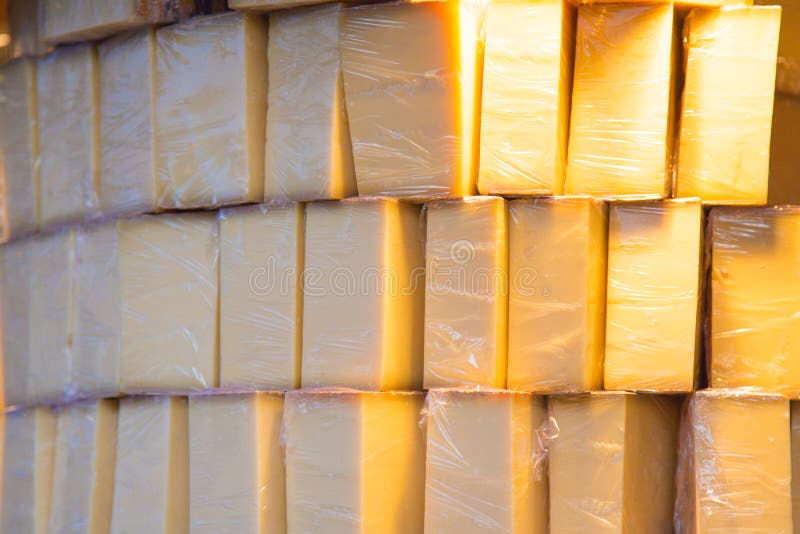 Packed pile of cheese stock photo. Image of sale, cheese - 64747248