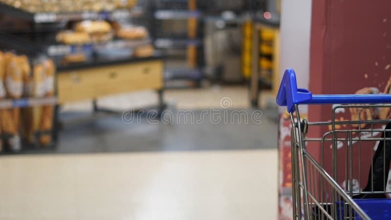 A Packed Trolley in a Supermarket with Various Grocery Items. Stock ...