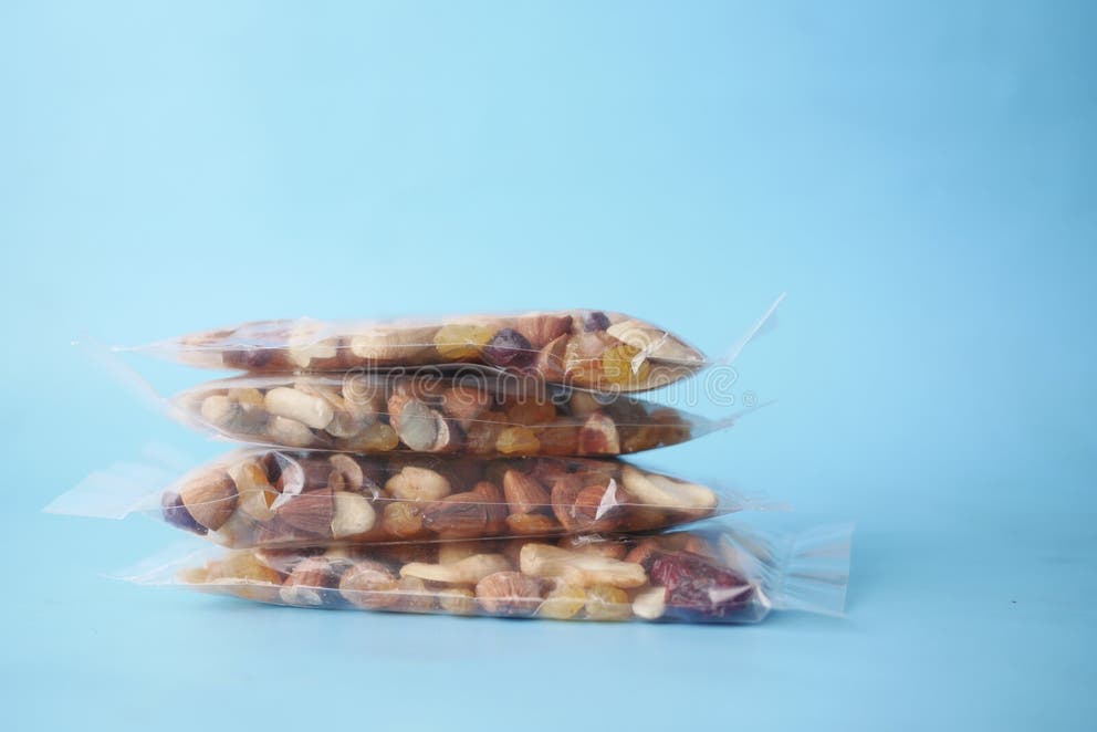 Packet of Mixed Nuts on Blue Background Stock Photo - Image of calcium ...