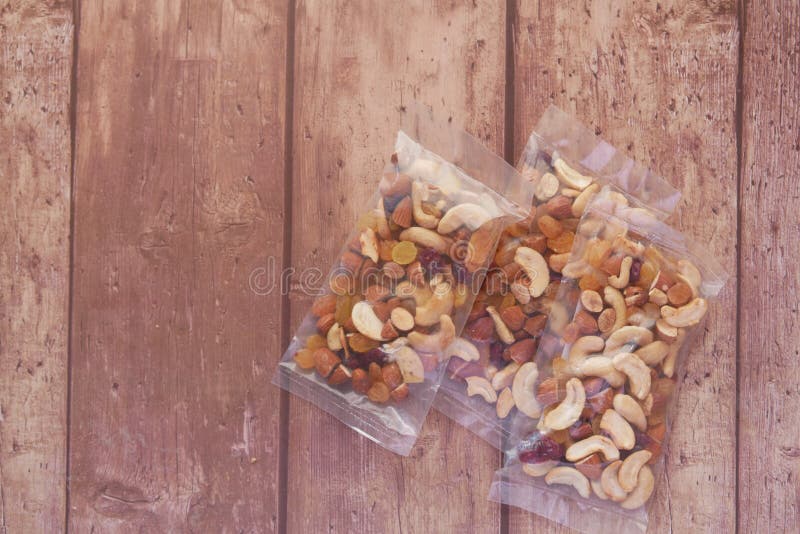 Packet of Mixed Nuts on Wooden Background Stock Image - Image of almond ...