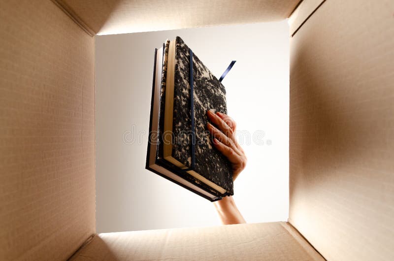 Packing books in a box stock photo. Image of books, inside - 379549140
