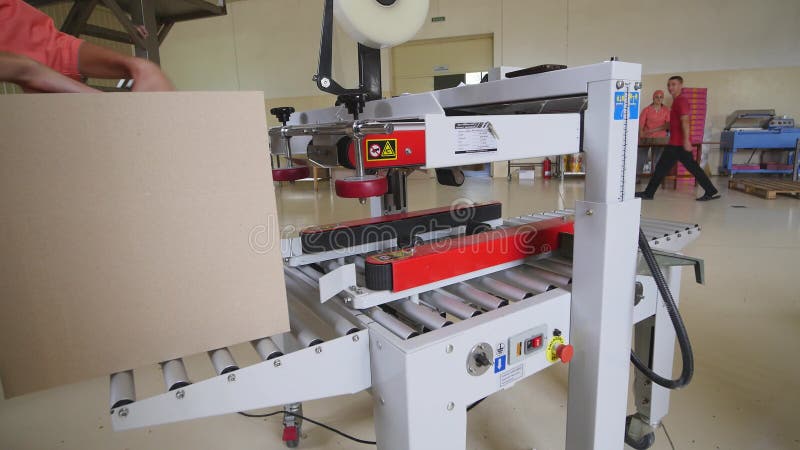 Packing Boxes Along Conveyor Stock Photo - Image of high, clothing ...